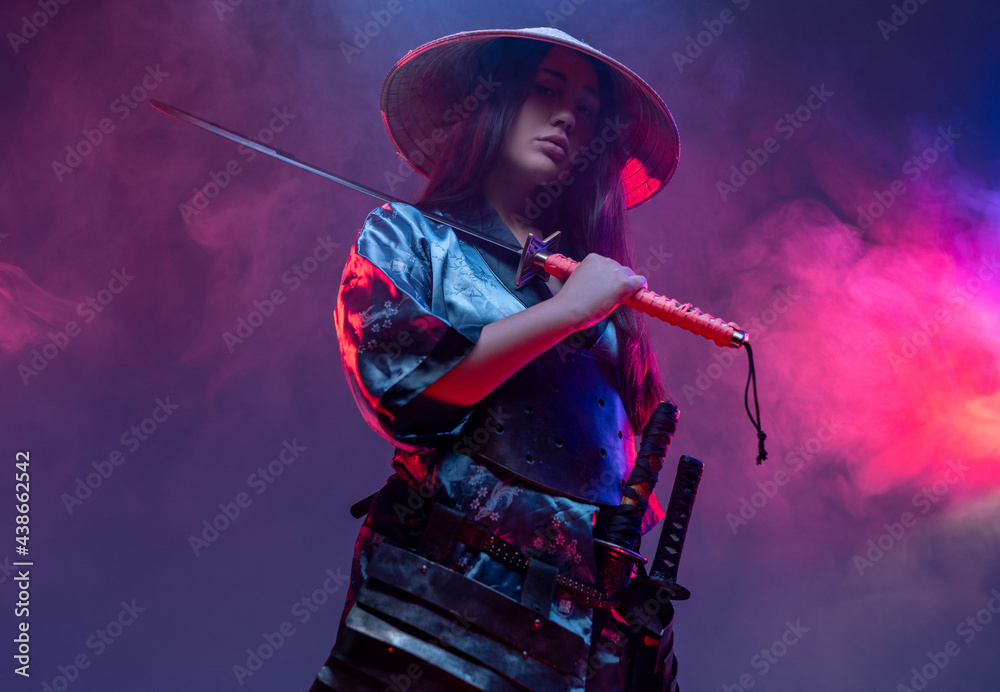 Futuristic female samurai with sword inside studio Stock Photo | Adobe ...