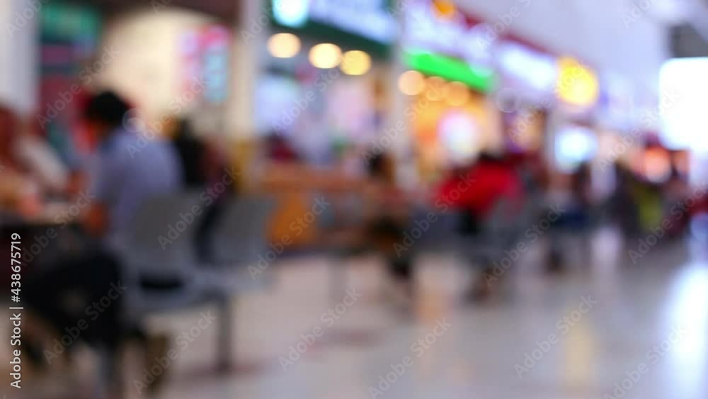 Defocused view with unrecognisable people wearing facemasks that are ... Defocused view with unrecognisable people wearing facemasks that are ...