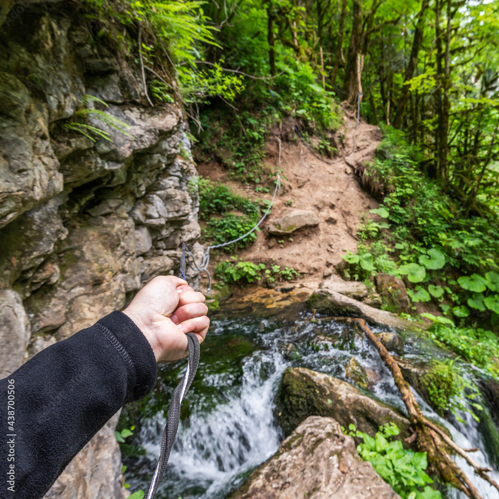 Dangerous rope crossing over a mountain waterfall Stock Photo | Adobe Stock