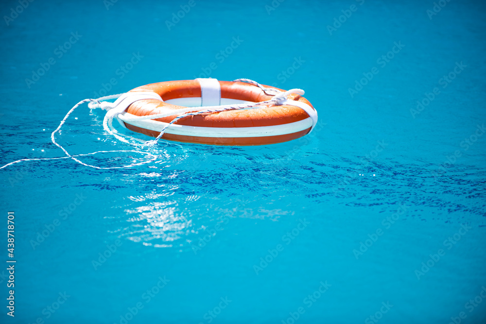 Help and drowning concept. Life saver ring floating in the water. Stock ...