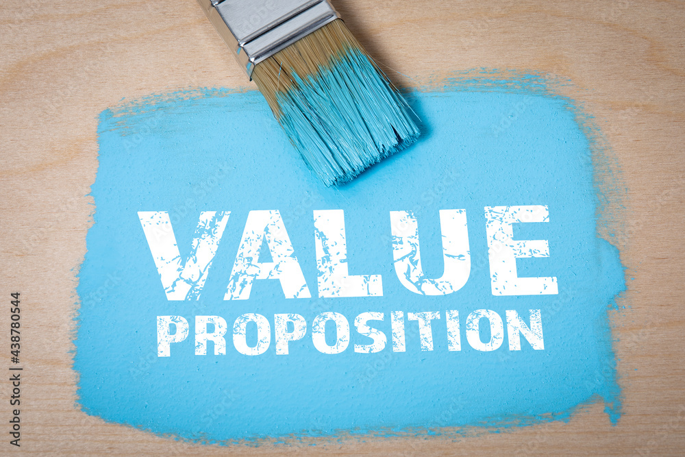 Value Proposition. Blue color and a brush on a plywood background Stock ...