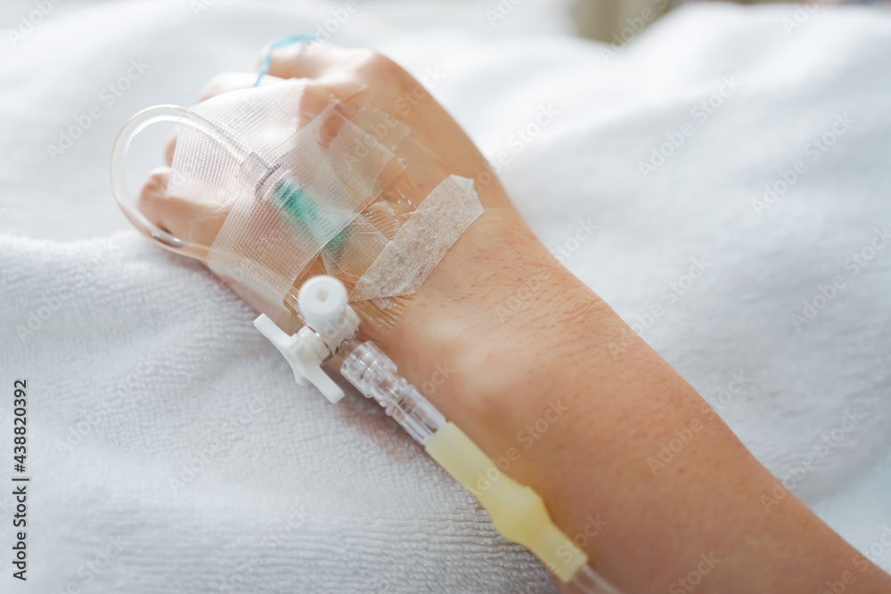 Saline solution on hand of Asian women patient lying close up shot on ...