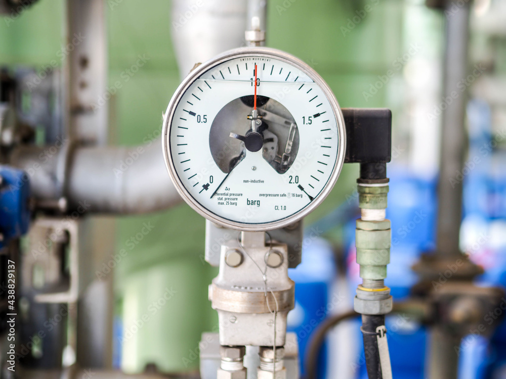 Pressure gauge of measuring instrument close up in industry zone at ...