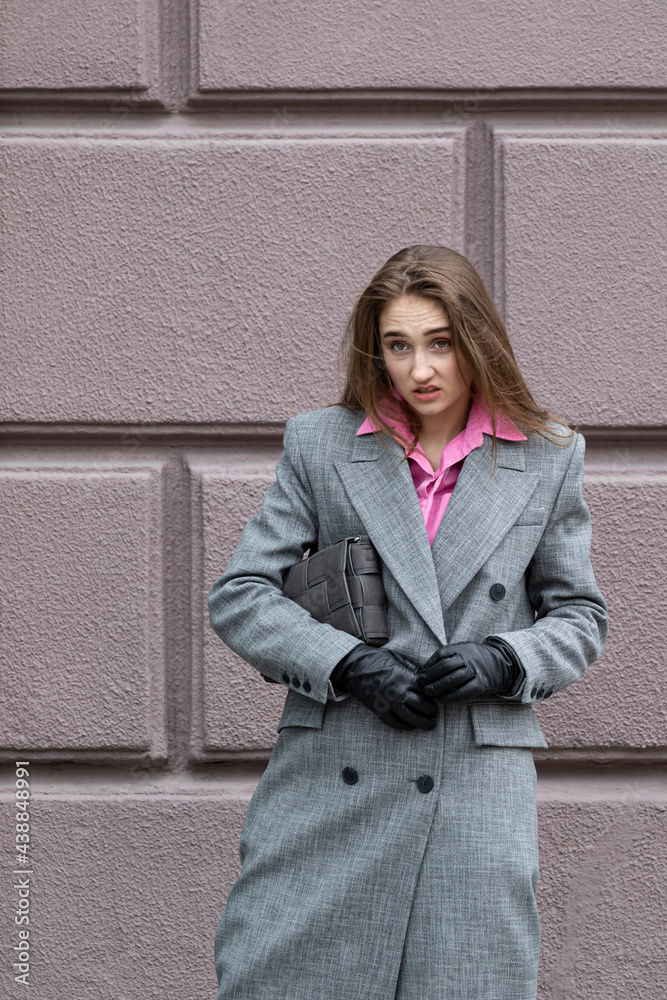 A vertical photo of a young girl with a cocky look and a clear emotion ...