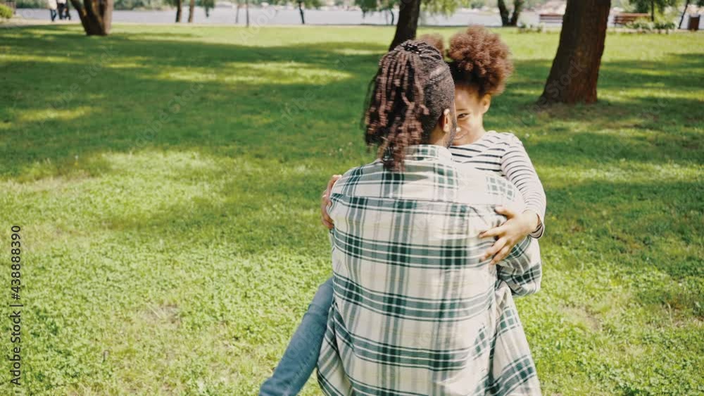 Close portrait of a dark-skinned family, father and daughter have fun ...