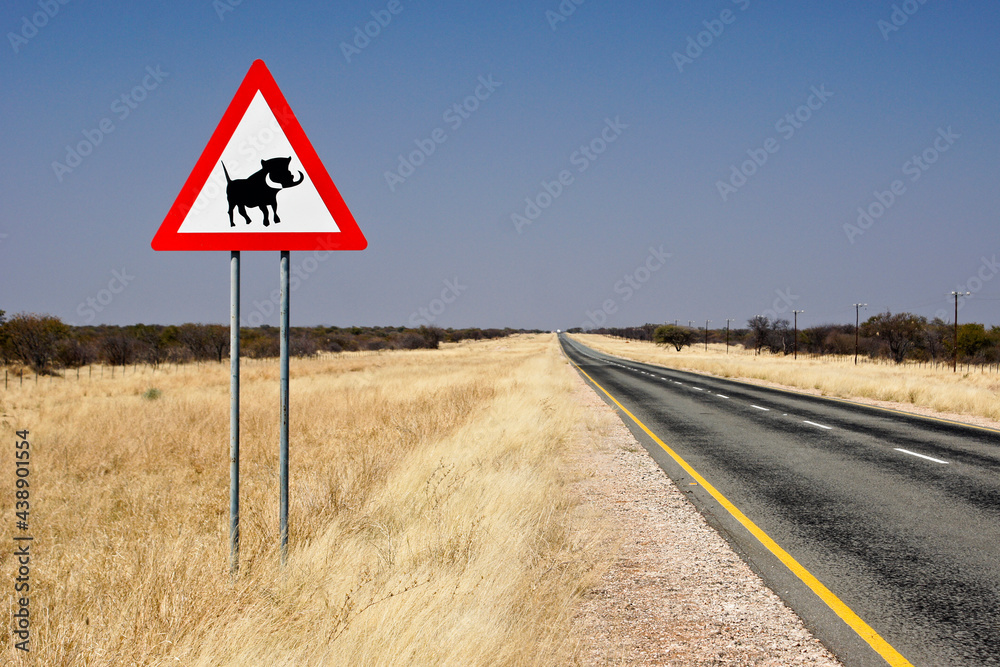 Warning sign for warthogs on highway, Namibia Stock Photo | Adobe Stock