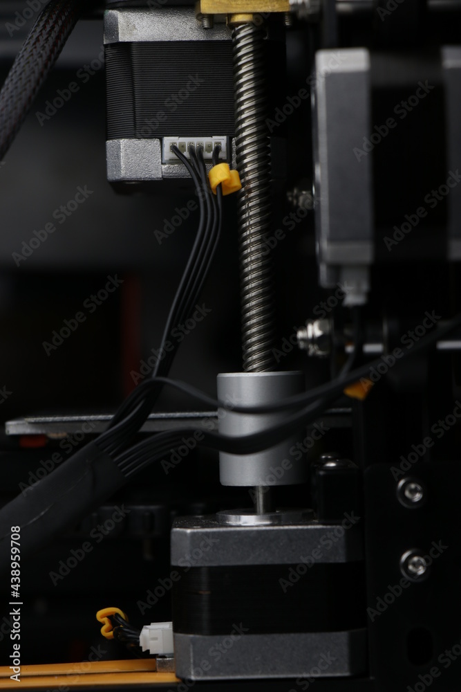 Wires connect to stepper motors of 3d printer with threaded rod visible ...