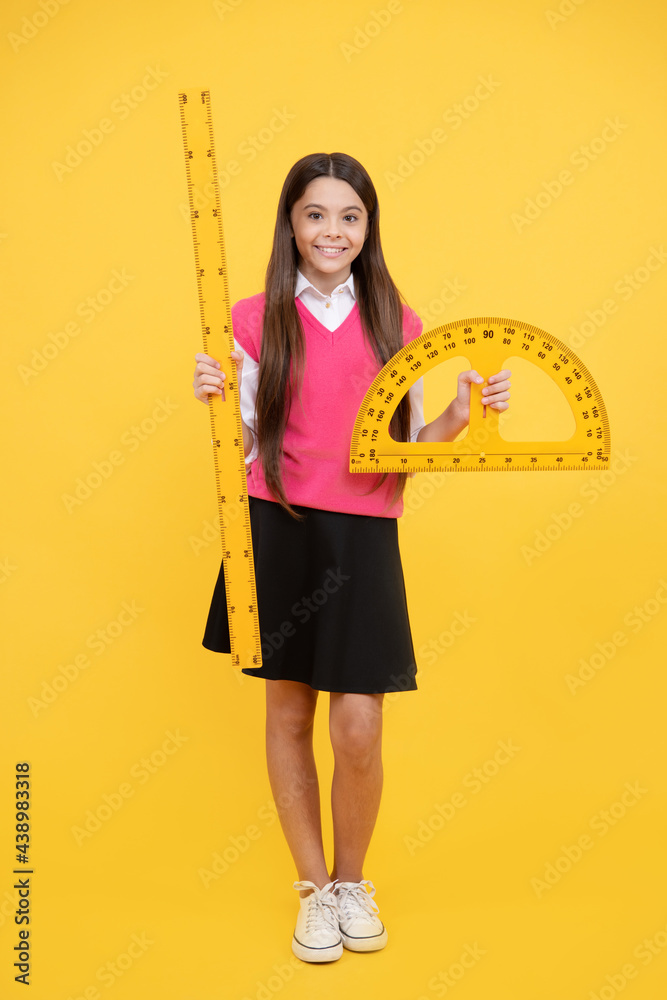 cheerful teen girl study math with protractor ruler measuring size ...