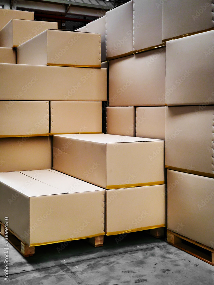 Stacks of boxes in industrial factory Stock Photo | Adobe Stock