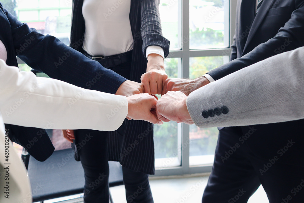 businessman and woman putting hands fist join together, business ...
