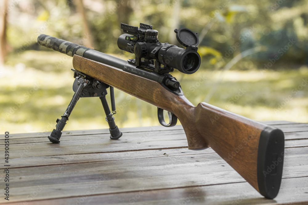 Wooden sniper rifle with scope and bipod Stock Photo | Adobe Stock