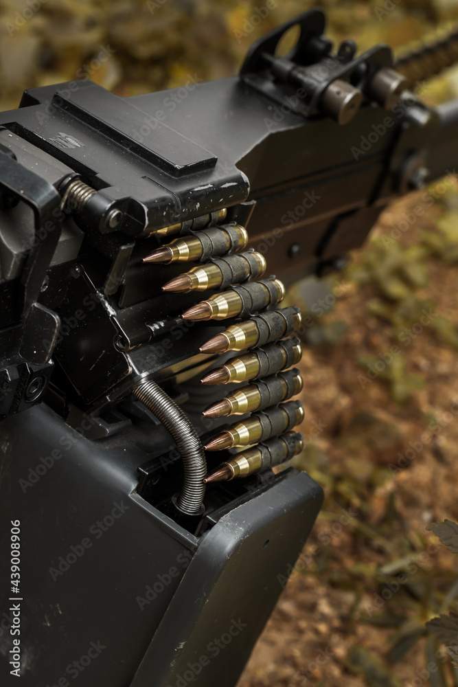 M249 light machine gun with 7.62 mm cartridge belt black and white ...