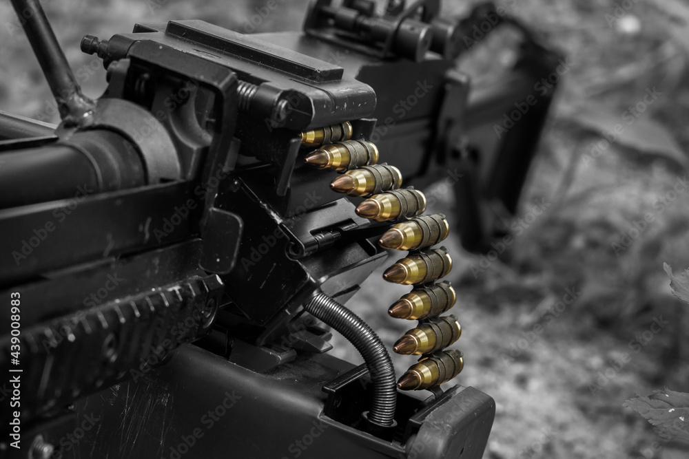 M249 light machine gun with 7.62 mm cartridge belt black and white ...