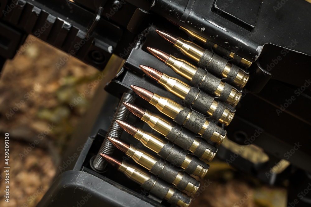 M249 light machine gun with 7.62 mm cartridge belt black and white ...