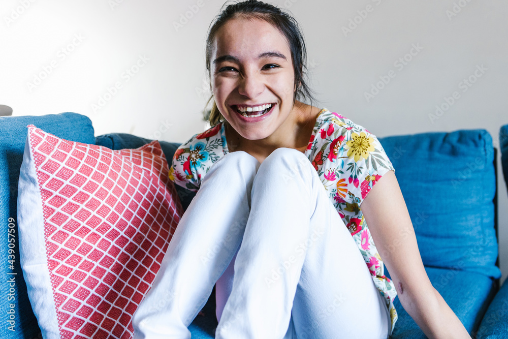 portrait of disabled cerebral palsy hispanic teen girl with natural ...