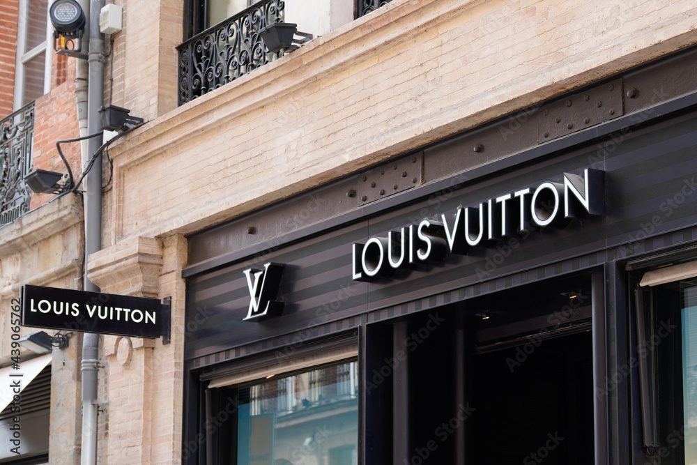 louis vuitton logo brand and sign text front of up store fashion shop ...