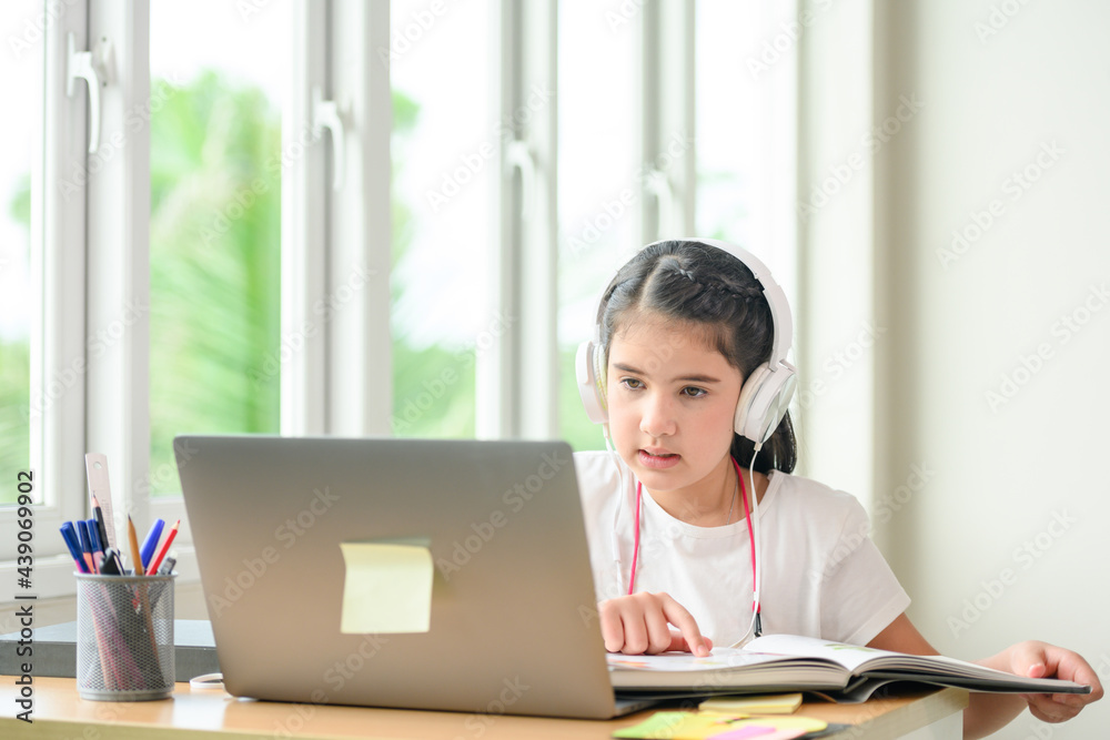 girl student She is studying hard and is happy to study online with a ...