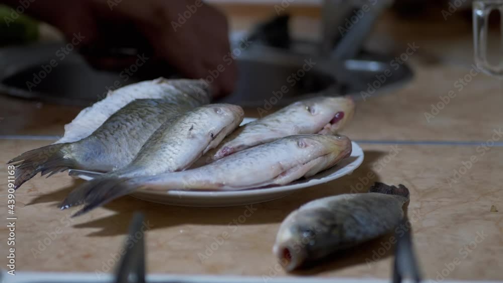 Fresh gutted Fish Crucian Carp Lies on Dish Plate and Table. Fish with ...