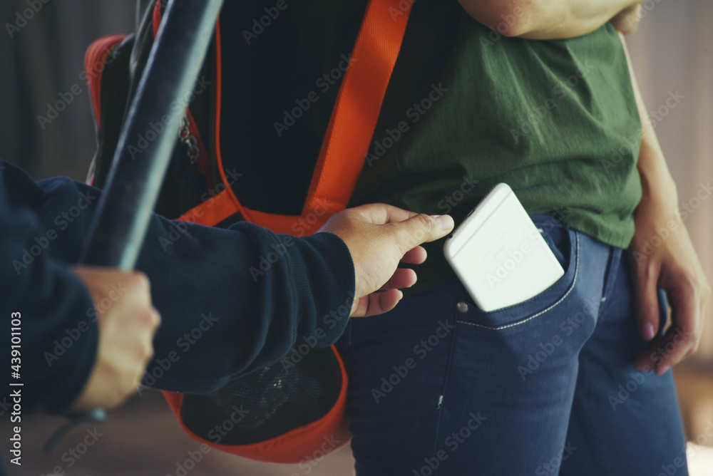 Thief armed man rob woman by baton on street stalker behind young woman ...