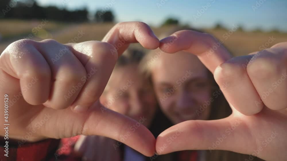 kids hands shape of heart,symbol of love.Smiling positive faces of ...