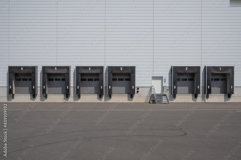 Trucks at loading ramps of a warehouse. Image for delivery, delivery ...