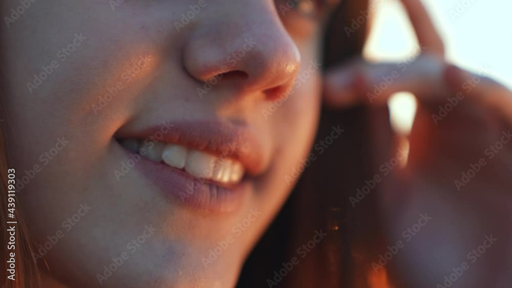 Girl face at sunset. Girl of dreaming. Lips smile. Girl face in wind ...