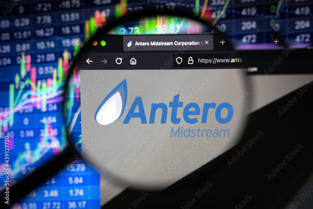 Antero Midstream company logo on a website with blurry stock market developments in the ...