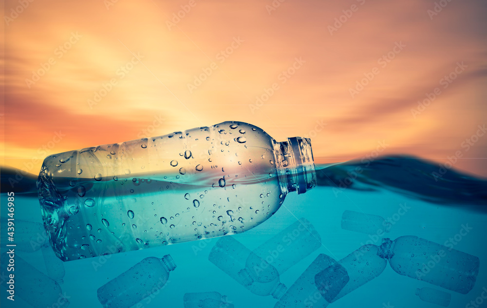 Plastic bottles float in the sea. Plastic waste floats in the water ...