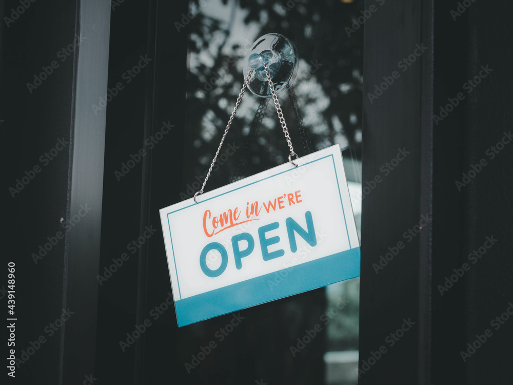 "Come in we're open" in cafe.We're Open hang on door or window of ...