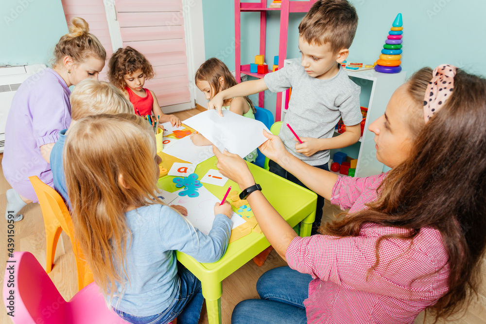 Preschool children learn english alphabet using cards Stock Photo ...