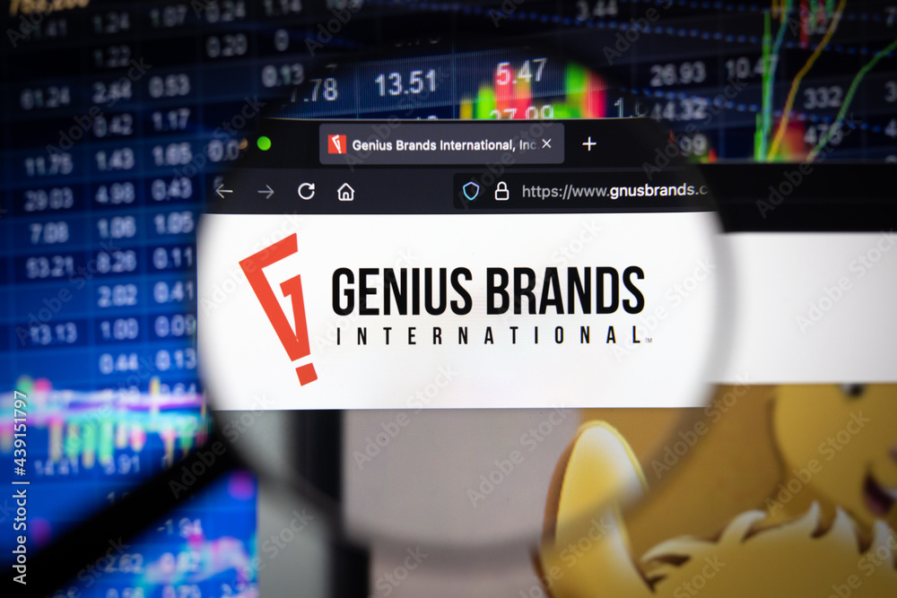 Genius Brands company logo on a website with blurry stock market ...