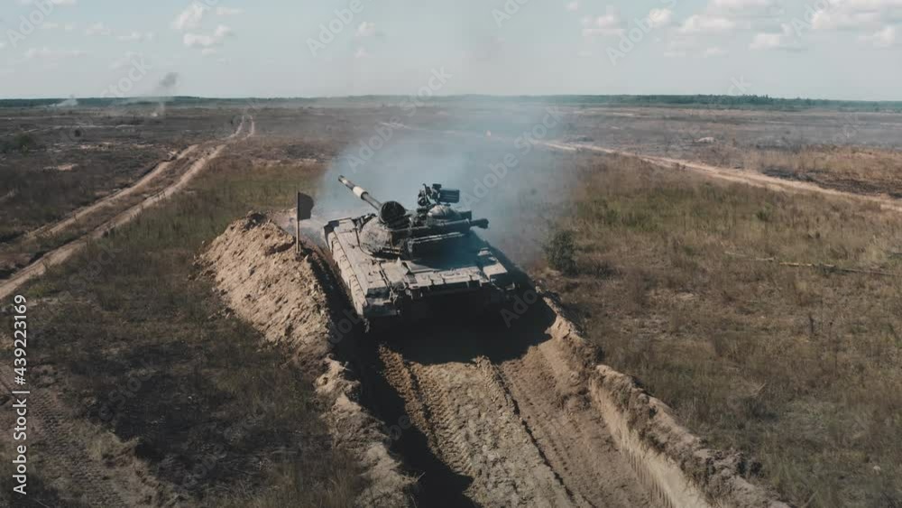 Army military tank training demonstration. Aerial back view flight ...