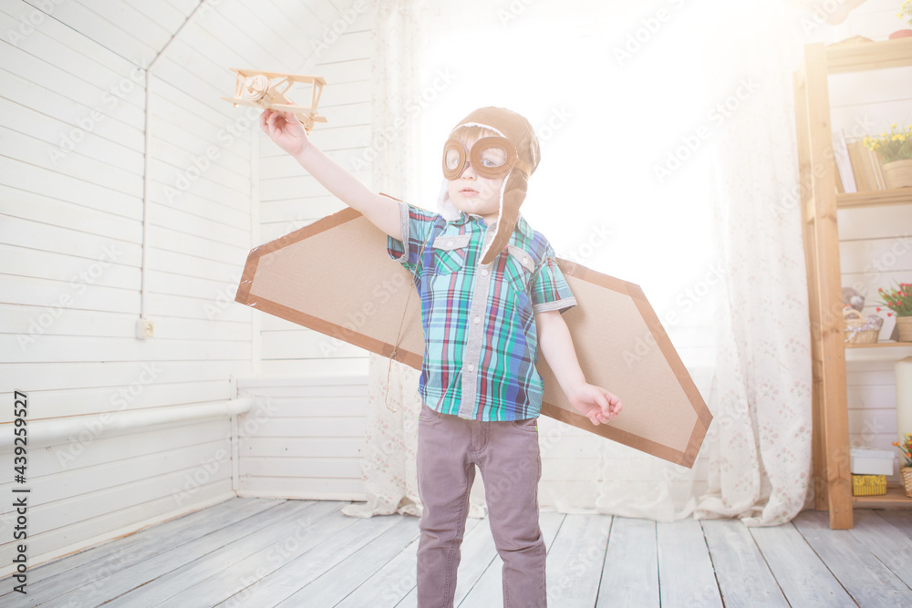 Children boy wearing pilot costume making ready to fly gesture standing ...