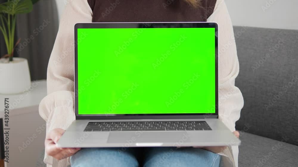 Woman presentation laptop with green screen and chroma key mockup on ...