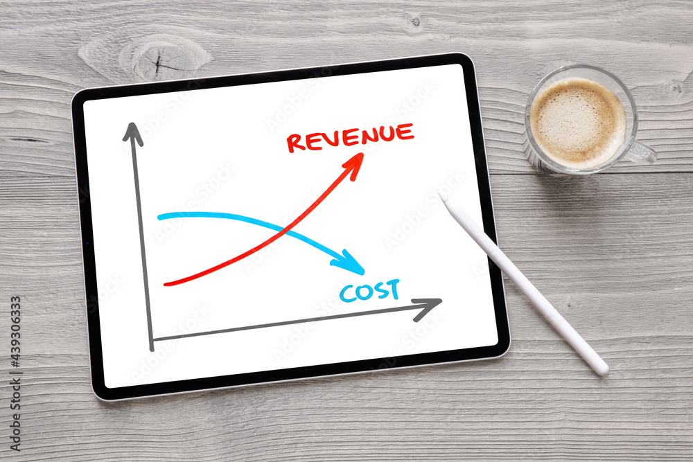 Graph of revenue and cost drawn on the screen of tablet computer Stock ...