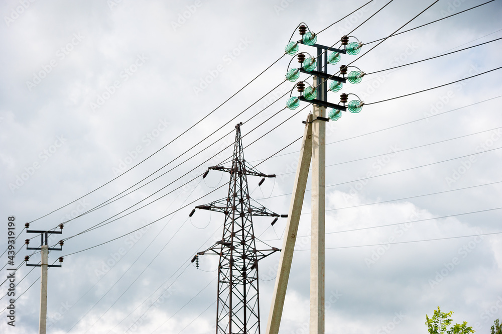 Power line - wires on poles and insulators. Stock Photo | Adobe Stock