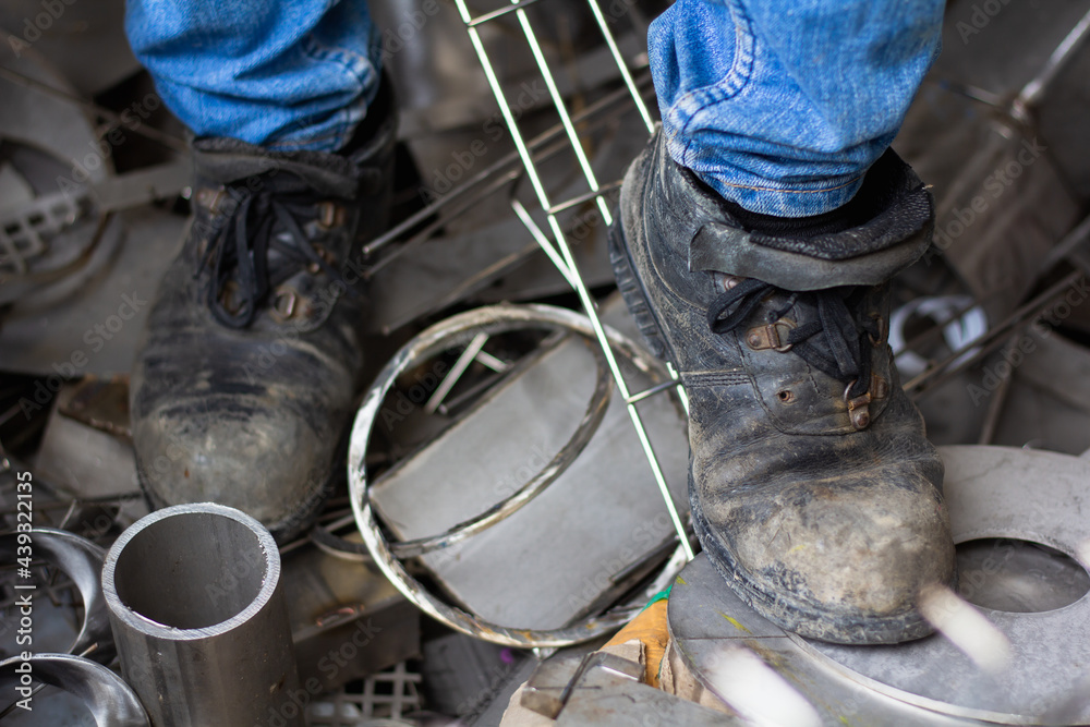 Wear safety shoes to ensure safety at work. construction workers wear ...