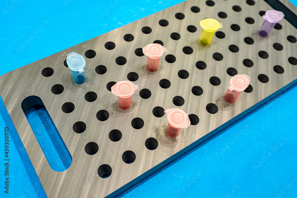 Metal rack with multi colored test tubes. Bright test tubes in chemical ...