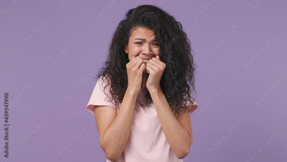 Scared shocked young african american woman 20s years old wears pink T ...
