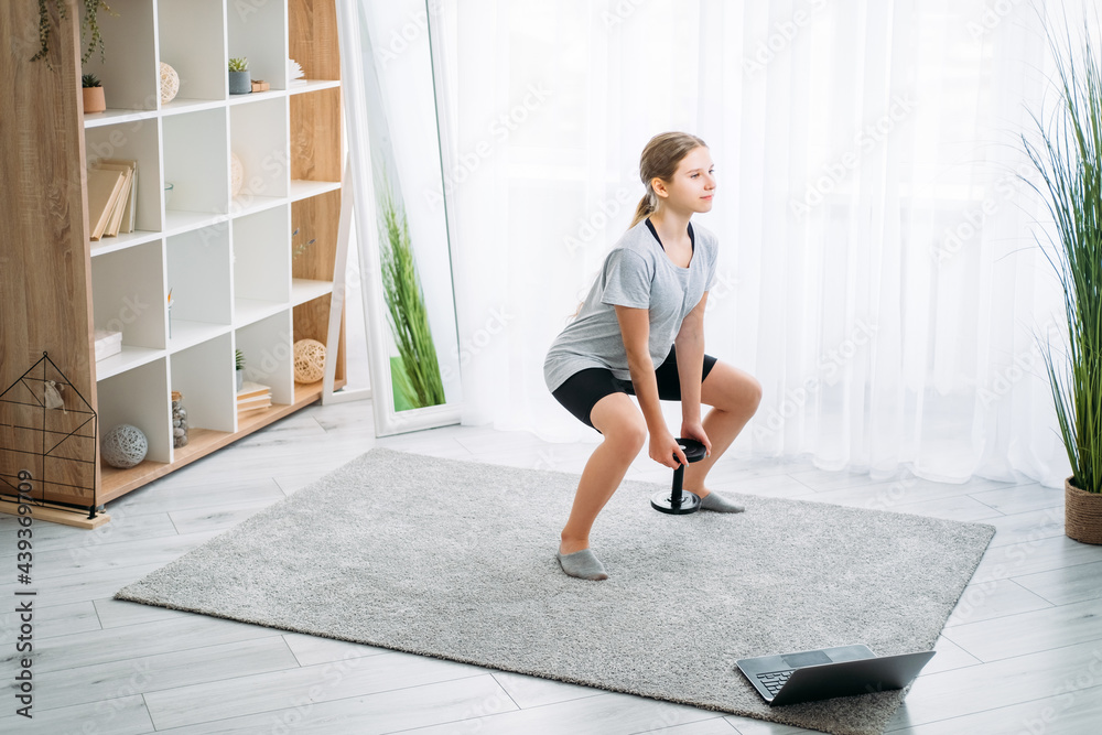 Child home sport. Fitness online. Wellbeing motivation. Athletic girl ...