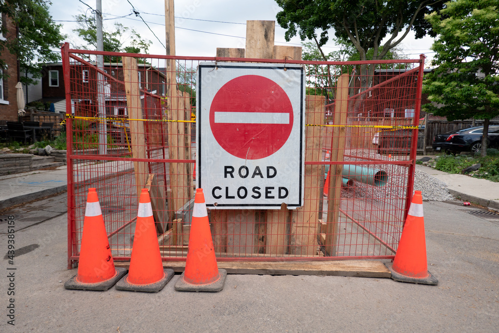 Road Closed, men at work signage: Pipes and fixtures used in a project ...