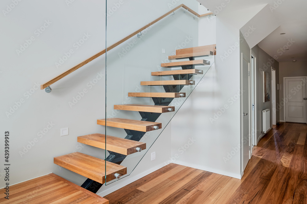 Architectural floating staircase in luxury home Stock Photo | Adobe Stock