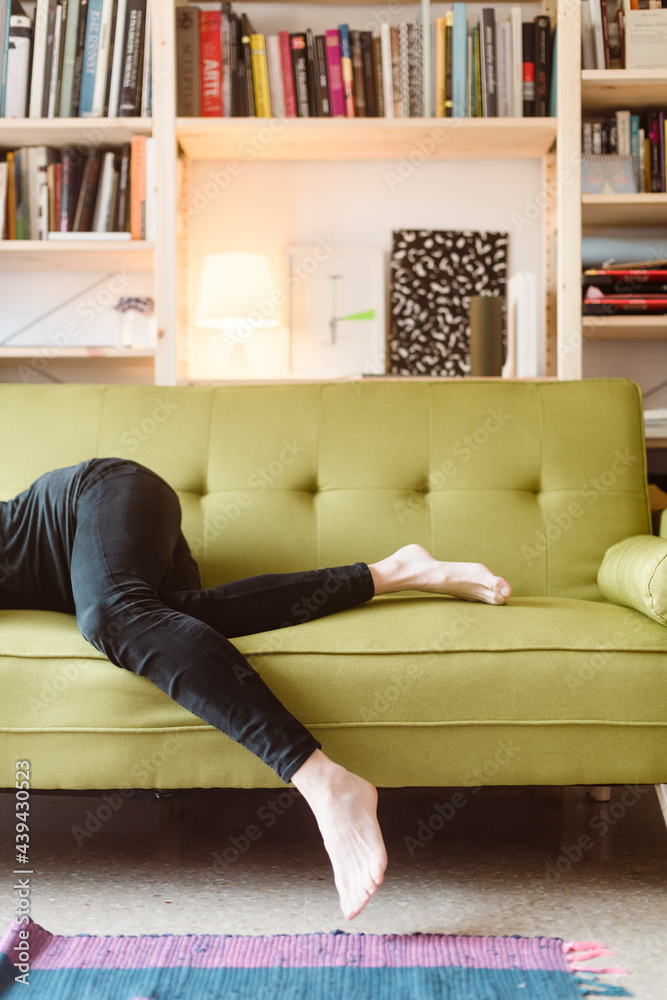 Relaxed female body on the sofa Stock Photo | Adobe Stock