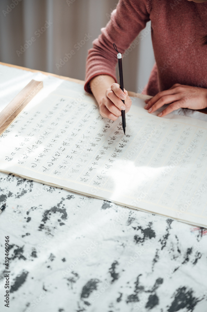 Asian woman writing calligraphy Stock Photo | Adobe Stock