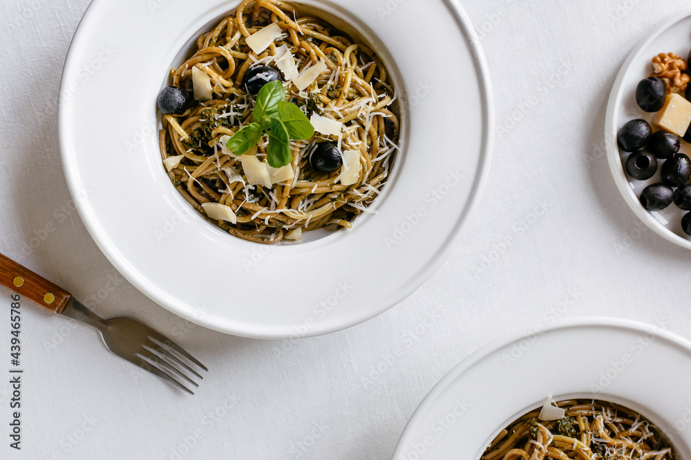 Spaghetti with cheese and olives Stock Photo | Adobe Stock
