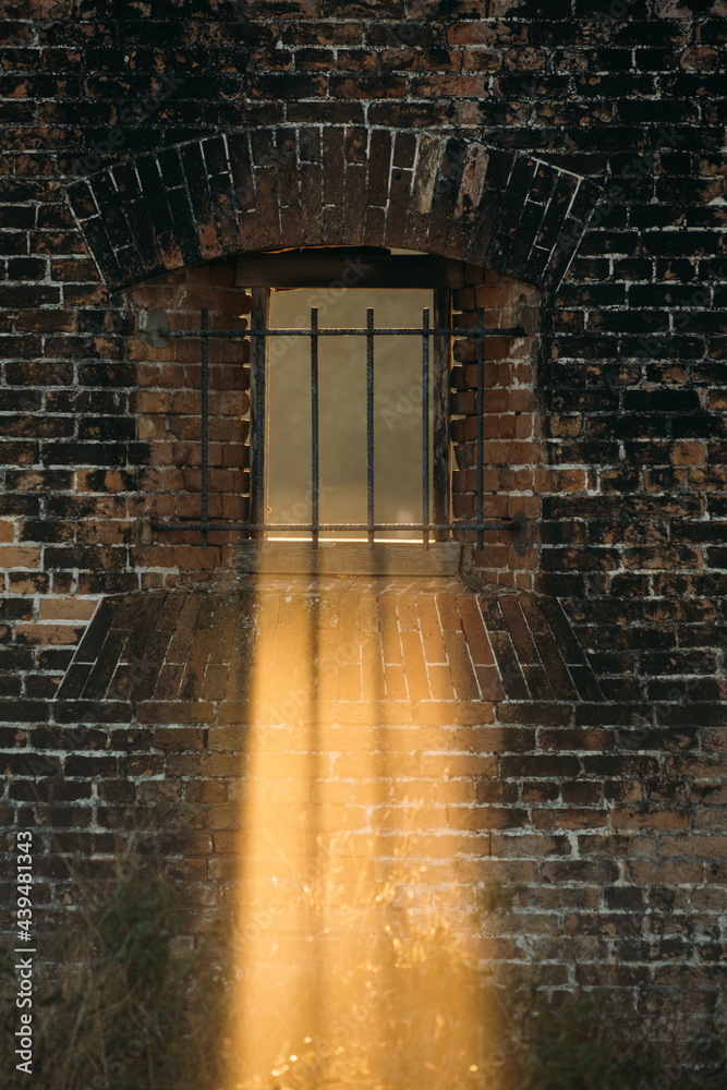Golden Light Shining Through Barred Window Stock Photo | Adobe Stock