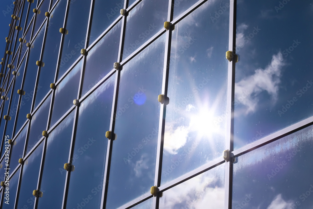 Architectural detail of the facade with multiple reflections of other ...