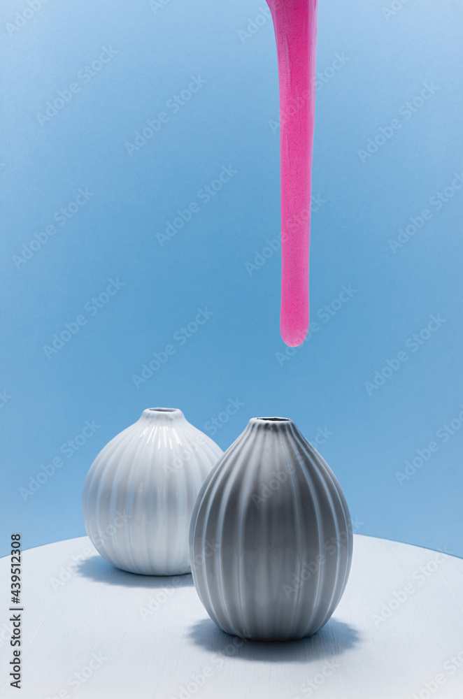 Pink viscous slime with glowing glitter flow down as stream and strives ...
