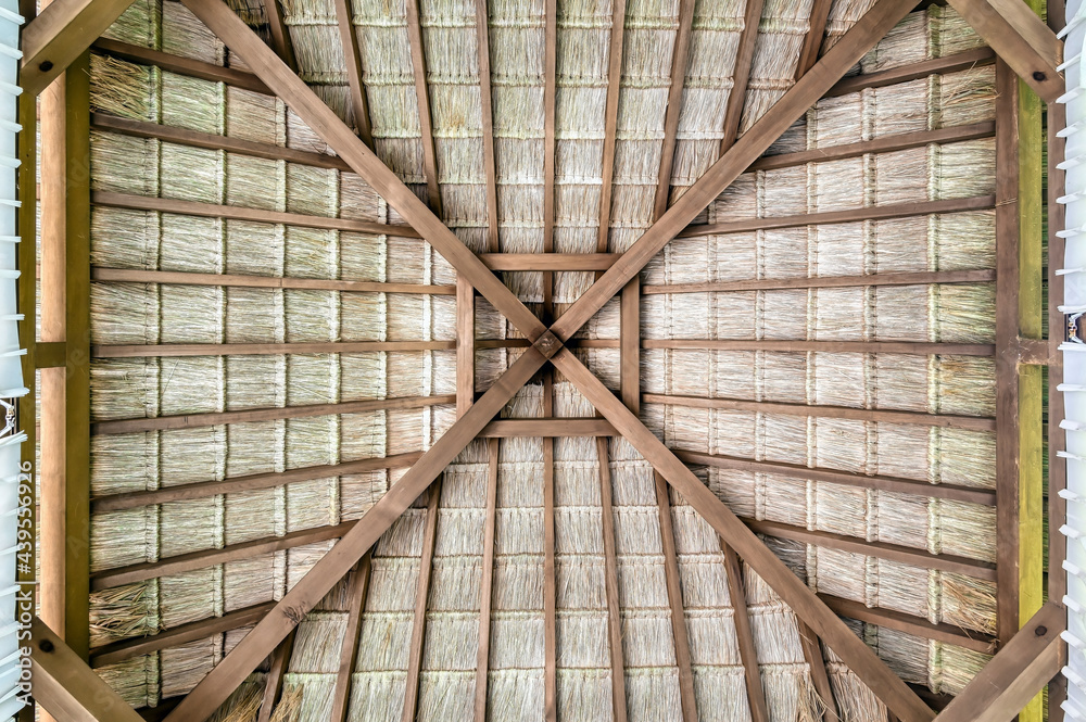 A traditional wood and straw thatched roof in Asian style Stock Photo ...