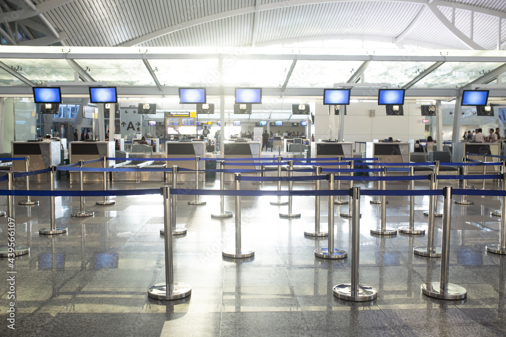 Coronavirus outbreak, empty check-in desks at the airport terminal due ...
